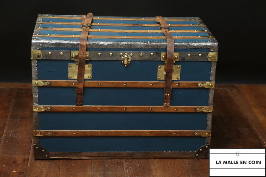 Flat blue steamer trunk with key